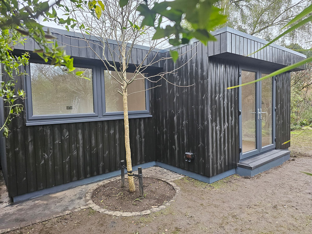 Insulated Workshop Designed Around a Tree
